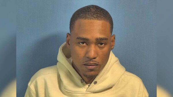 Convicted felon on parole from Chicago accused of having a gun outside ...
