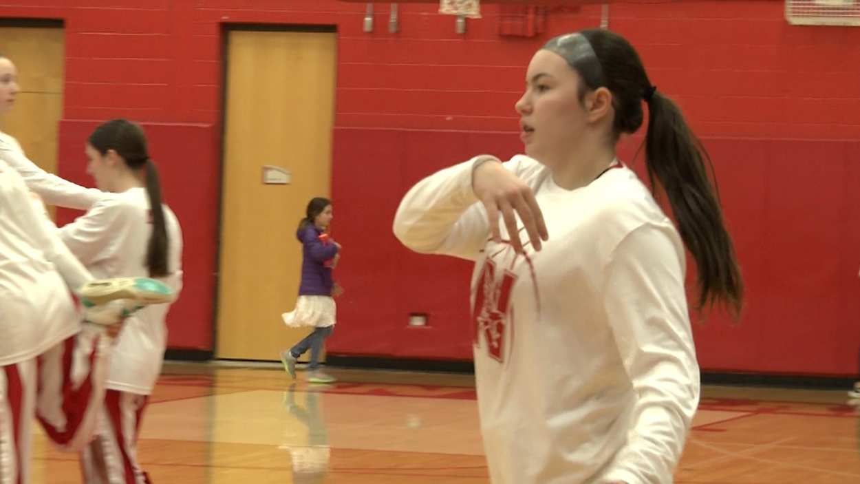Erin Hackett hits a running three at the buzzer for Naperville Central