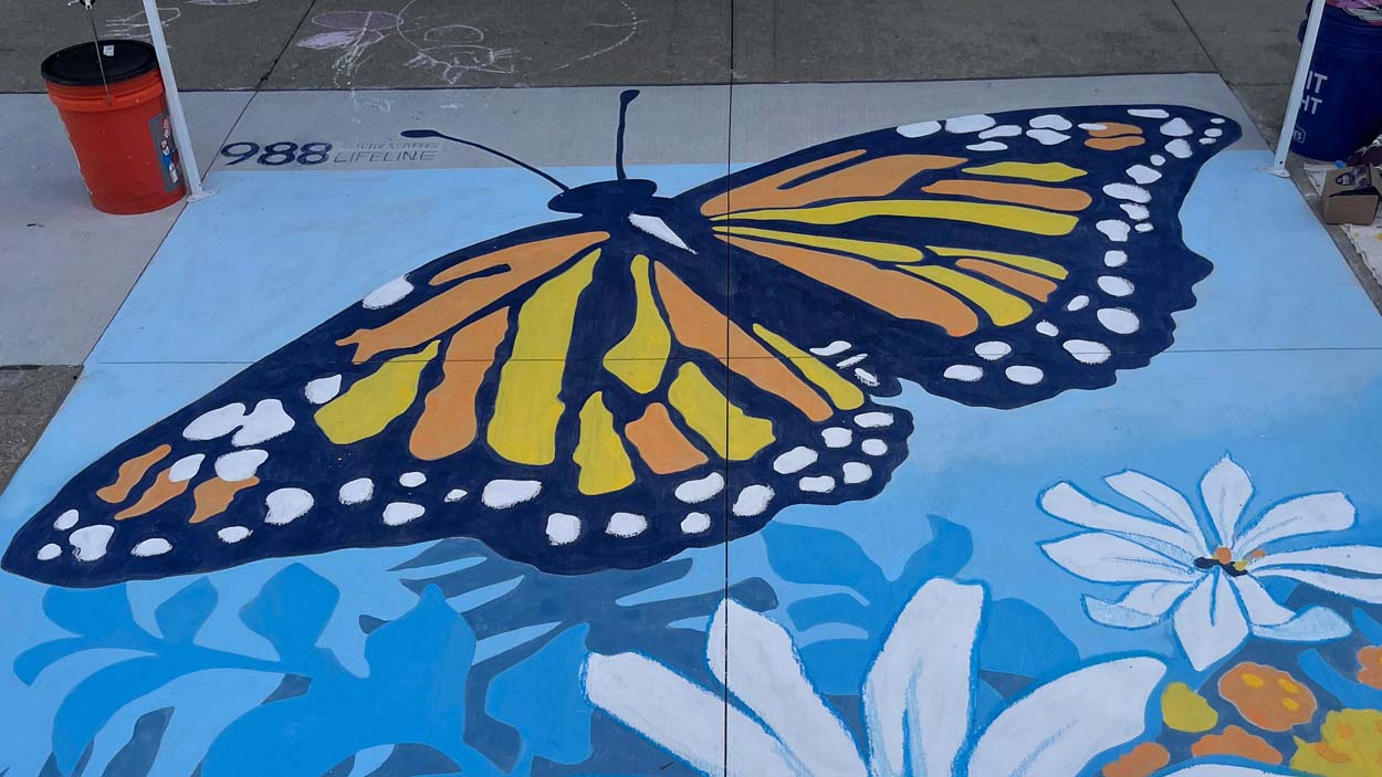 Artist chalks butterfly mural at Naperville Crossings as sign of hope ...